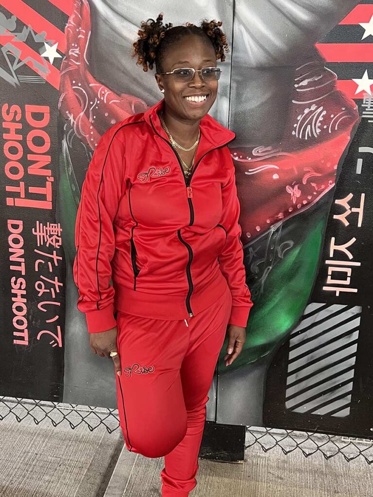 Woman’s Dripping Red tracksuit, black piping with custom rubber logo ...